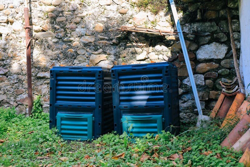 Two Rectangular Compost Bins Made of Plastic in the Backyard Garden ...