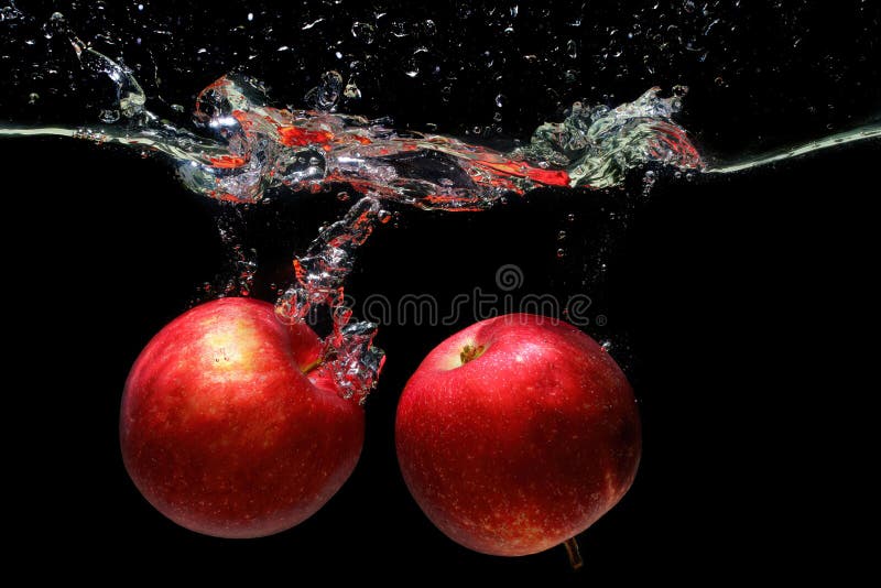 Two Red Apples Dropped in Water with Splashes Stock Image - Image of ...