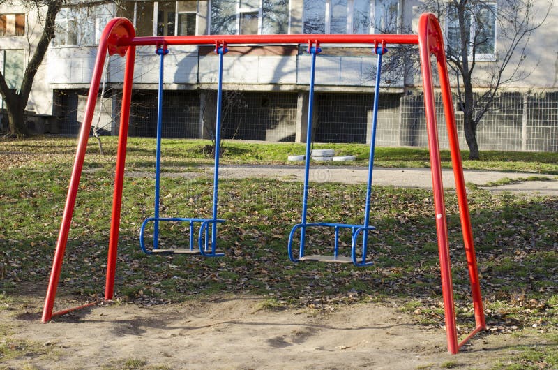 Two Blue Swings stock photo. Image of playgrounds, empty - 6492484