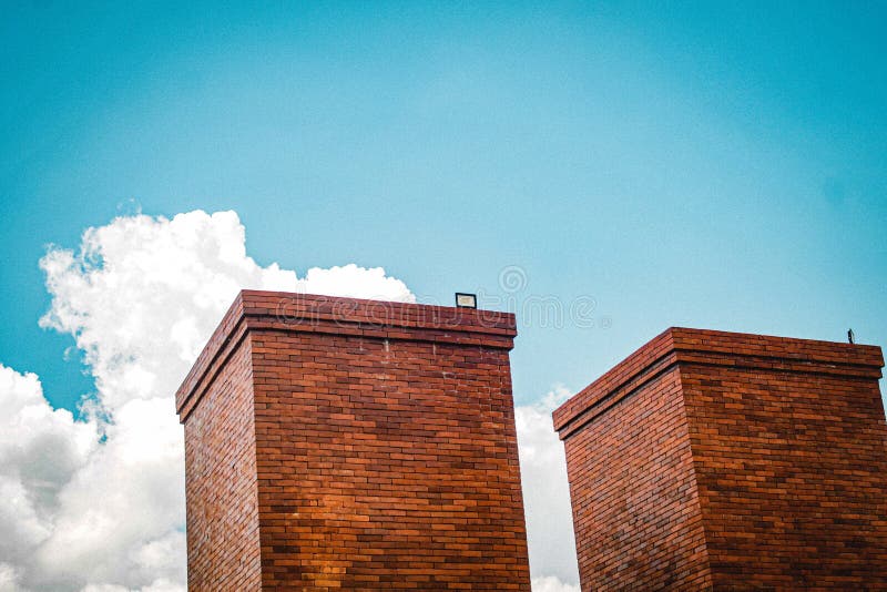 Two red brick towers stock photo. Image of building - 239968426