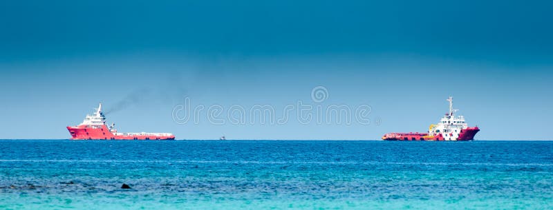 Two Red Cargo Ship on the Sea Stock Photo - Image of harbour, carrier ...