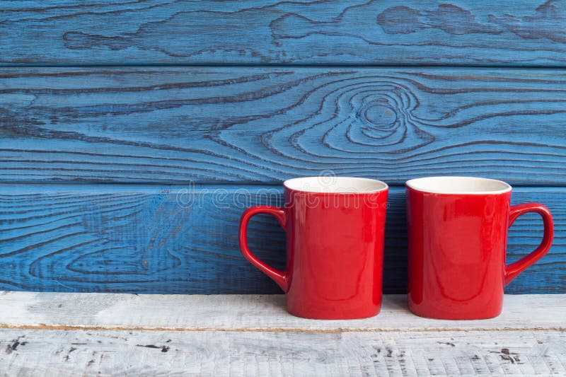 Two Red Coffee Cups On A Background Of Blue Boards Stock Photo - Image ...