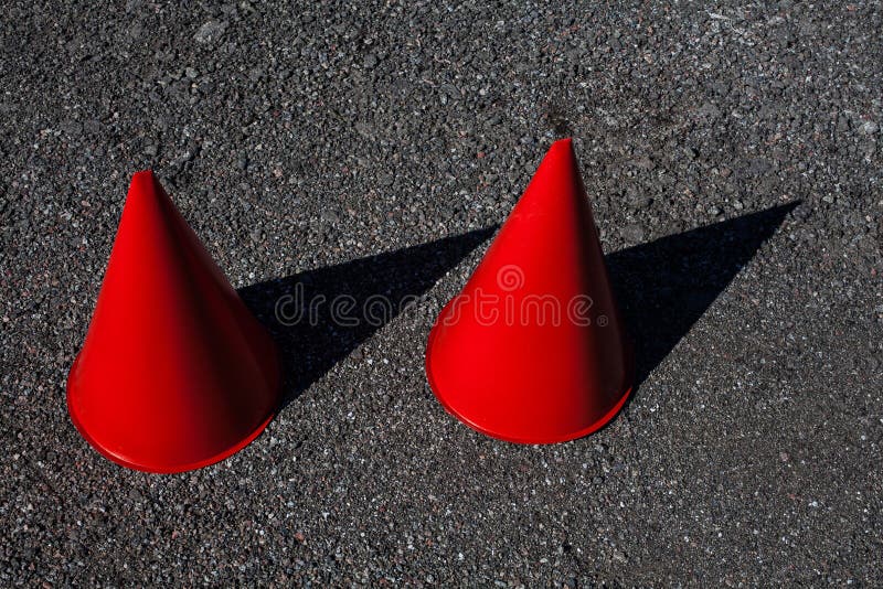 Two Red Cone-shaped Buckets for Firefighting with Sand Stand on a Dark ...
