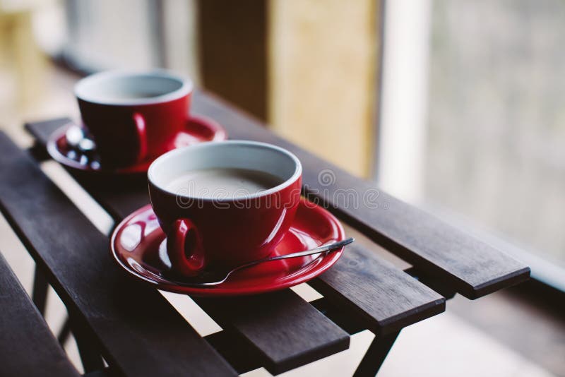 Two red cups on table stock image. Image of green, heat - 69741685