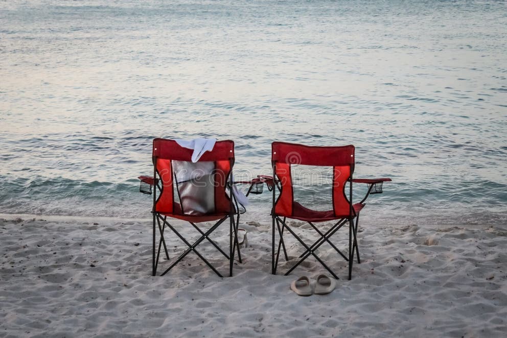 Tropical Vacation Theme. Two Red Folding Beach Chairs Set Up on a Sandy ...