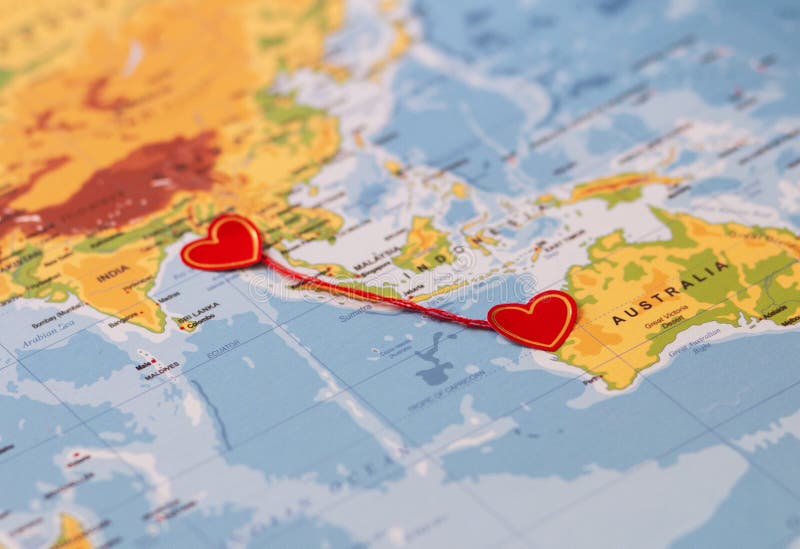 Two Red Hearts on a World Map Connected by a Red Thread Stock Photo ...