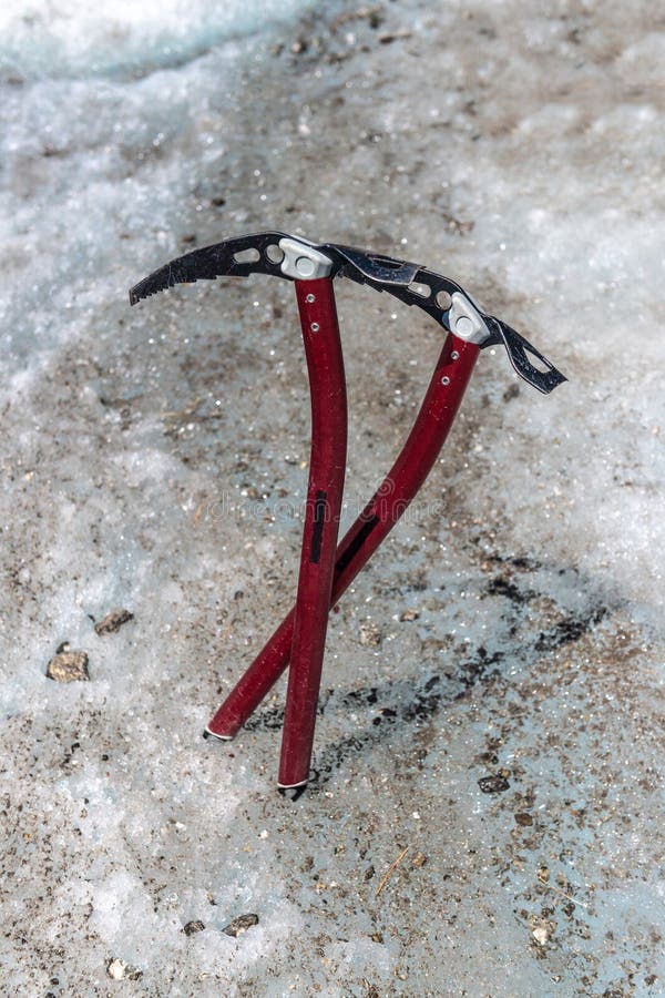 Two Red Ice Tool Crammed into Blue Ice, Ice Axe. Two Mountaineering Ice ...