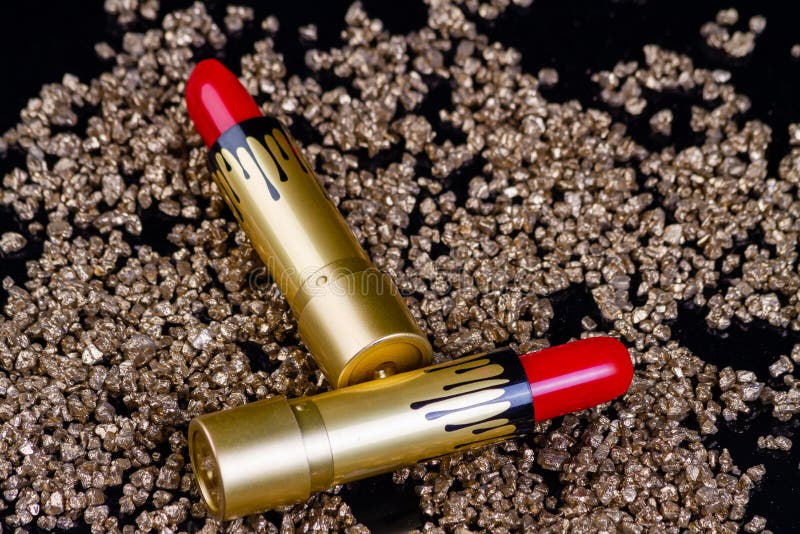 Two Red Lipsticks and Tiny Golden Rocks. Stock Photo - Image of style ...