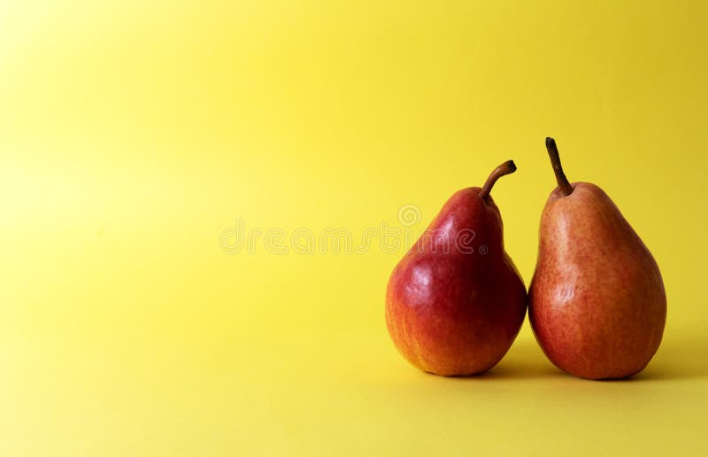 Two Red Pears on an Yellow Background Stock Image - Image of naturally ...