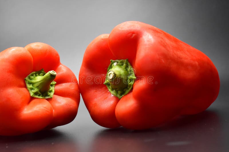Two Red Peppers in Studio with Black Background. Stock Photo - Image of ...