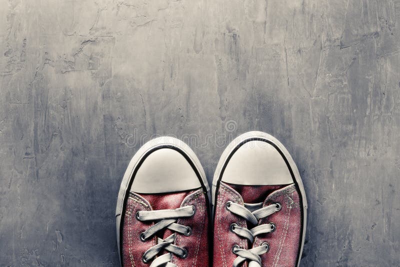 Two Red Sneaker on a Clean Concrete Background Stock Photo - Image of ...