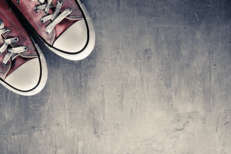 Two Red Sneaker on a Clean Concrete Background Stock Image - Image of ...