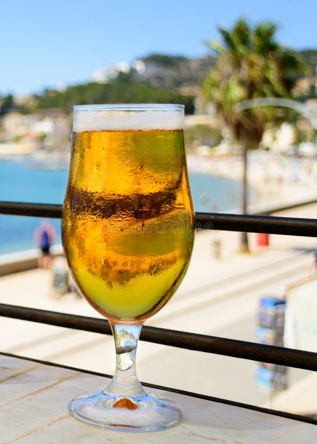 A glass of ice cold beer stock photo. Image of beverage - 184400268