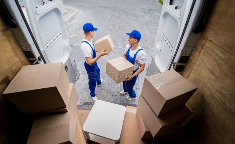 Two Removal Company Workers Unloading Boxes from Minibus Stock Photo ...