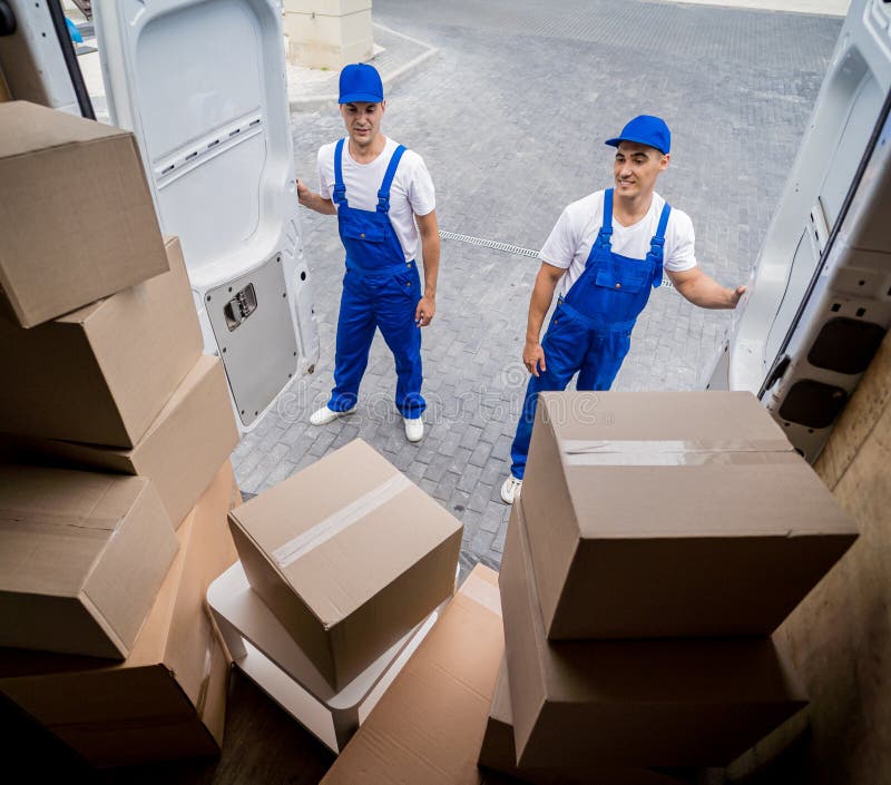 Two Removal Company Workers Unloading Boxes from Minibus Stock Photo ...