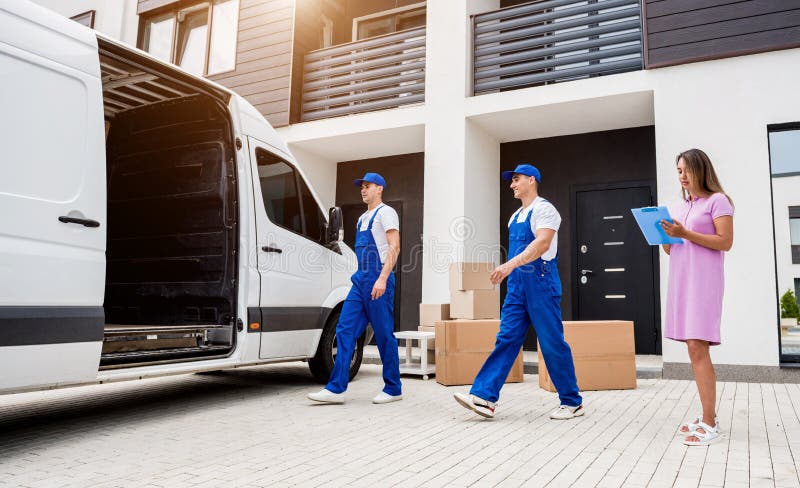 Two Removal Company Workers Unloading Boxes from Minibus into Customer ...