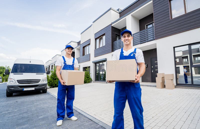 Two Removal Company Workers Unloading Boxes from Minibus into Customer ...