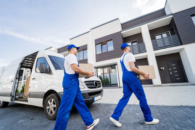 Two Removal Company Workers Unloading Boxes from Minibus Stock Image ...