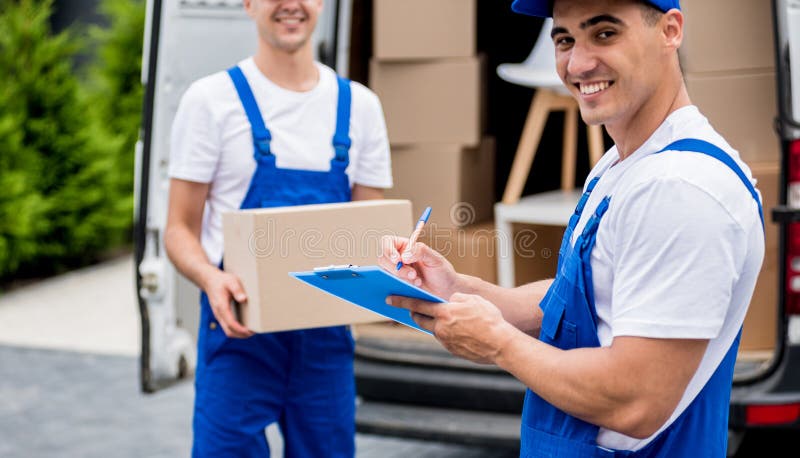 Two Removal Company Workers Unloading Boxes from Minibus into New Home ...