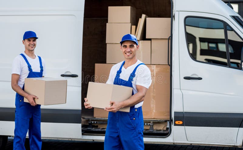 Two Removal Company Workers Unloading Boxes from Minibus into New Home ...