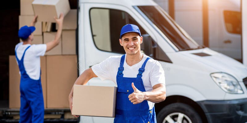 Two Removal Company Workers Unloading Boxes from Minibus into New Home ...