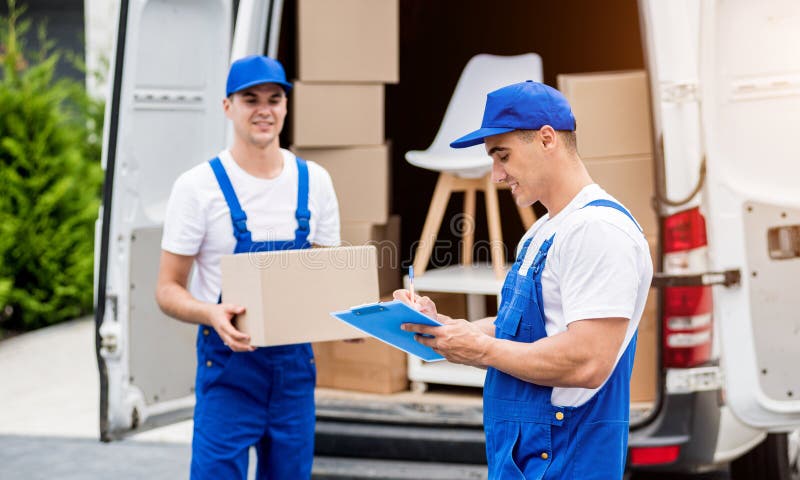Two Removal Company Workers Unloading Boxes from Minibus into New Home ...