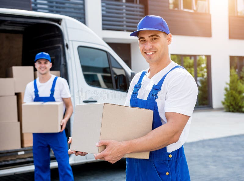 Two Removal Company Workers Unloading Boxes from Minibus into New Home ...