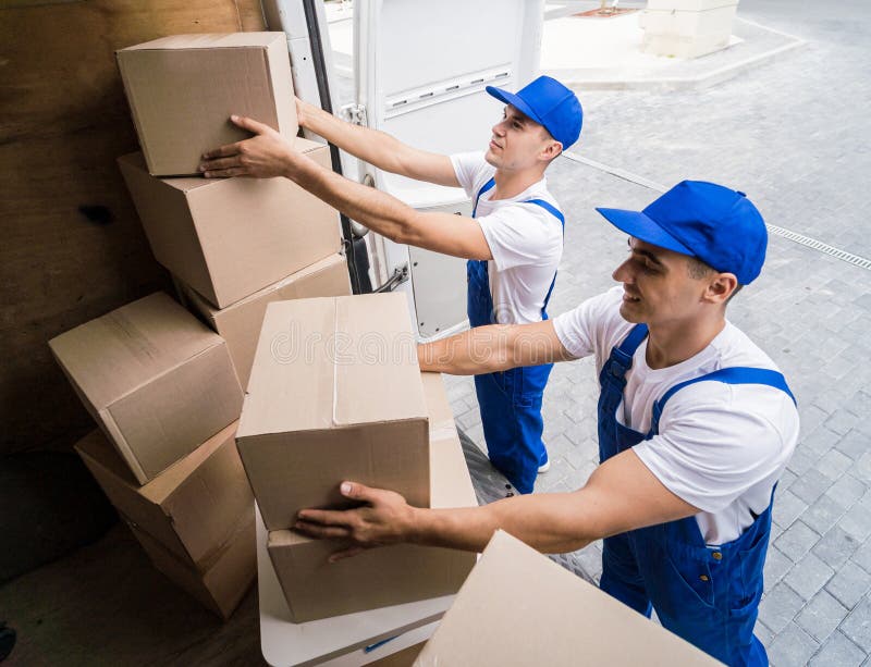 Two Removal Company Workers Unloading Boxes from Minibus Stock Image ...