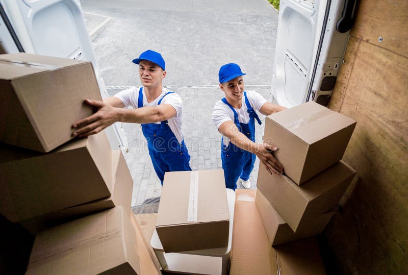Two Removal Company Workers Unloading Boxes from Minibus Stock Photo ...