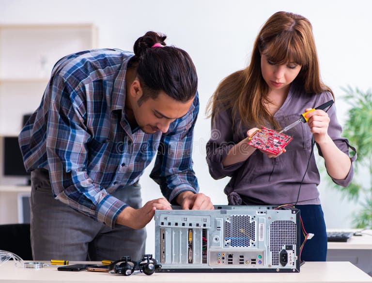 Two Repairmen Repairing Desktop Computer Stock Photo - Image of ...