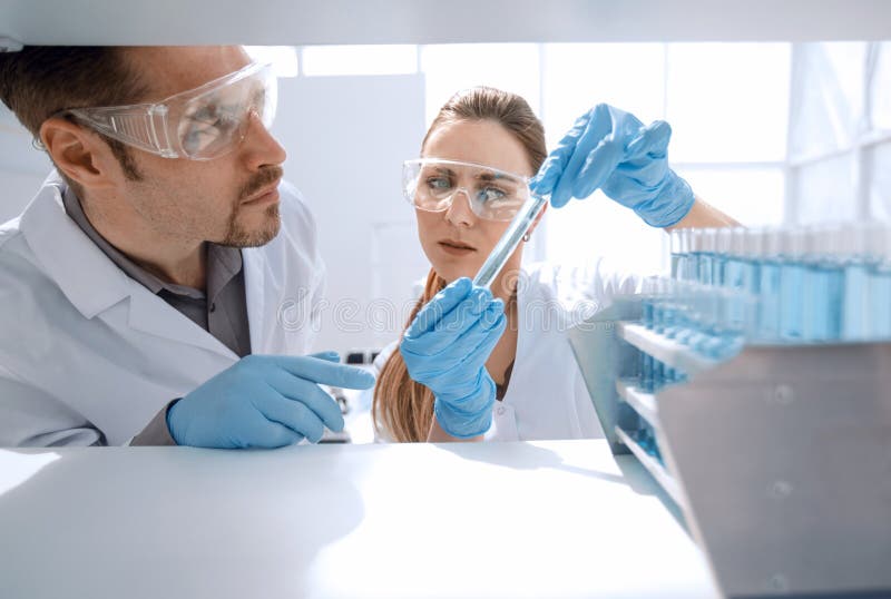 Two Researchers Discussing the Results of Laboratory Studies Stock ... Two Researchers Discussing the Results of Laboratory Studies Stock ...