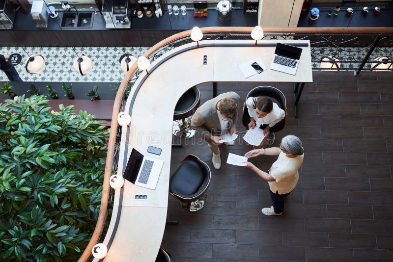 Two Responsible Young Students Working with Their Professor Stock Photo ...