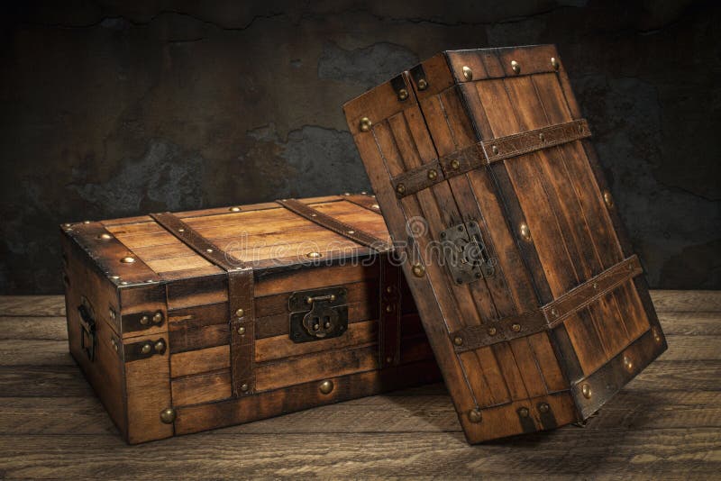 Two Retro Decorative Cases or Storage Boxes on a Rustic Table Stock ...