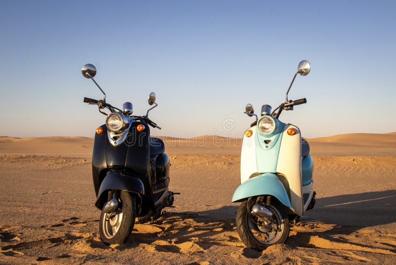 Two Retro Scooters at Sunset in the Golden Sand of the Namib Desert ...