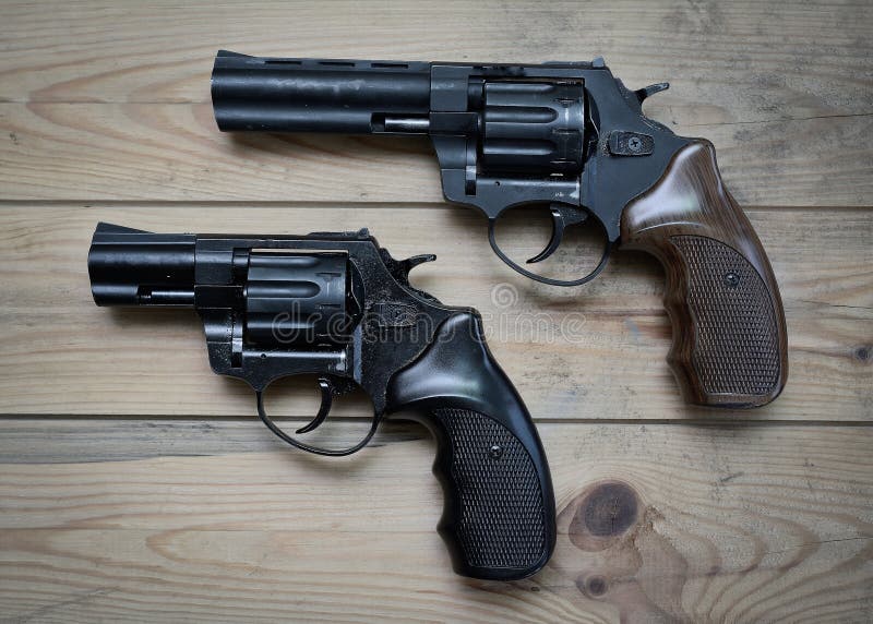 Two revolvers on a wooden stock photo. Image of wooden - 76062614