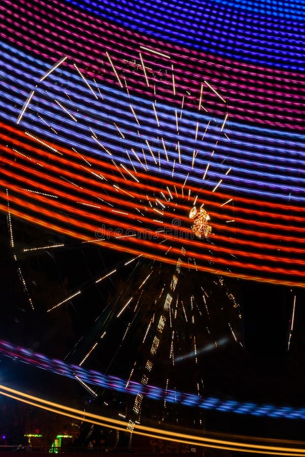 Two Rides in Motion in Amusement Park, Night Illumination. Long ...