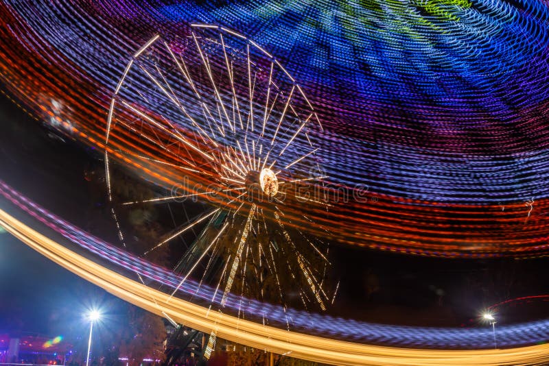 Two Rides in Motion in Amusement Park, Night Illumination. Long ...