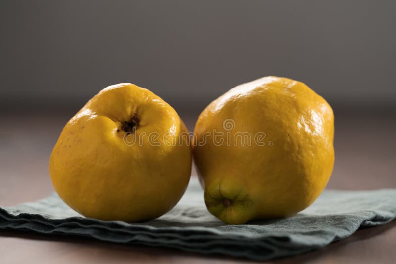 Two Ripe Quince Fruit on Wood Table Stock Photo - Image of ingredient ...