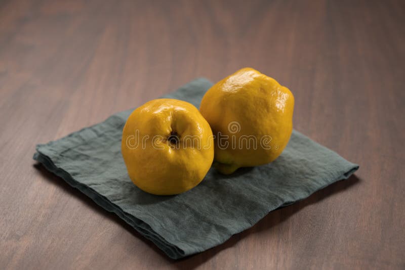 Two Ripe Quince Fruit on Wood Table Stock Photo - Image of autumn ...