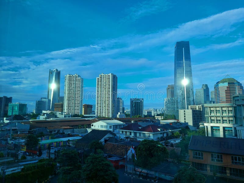 The Two Rising Sun Infront of the Building Tower in Jakarta Editorial ...