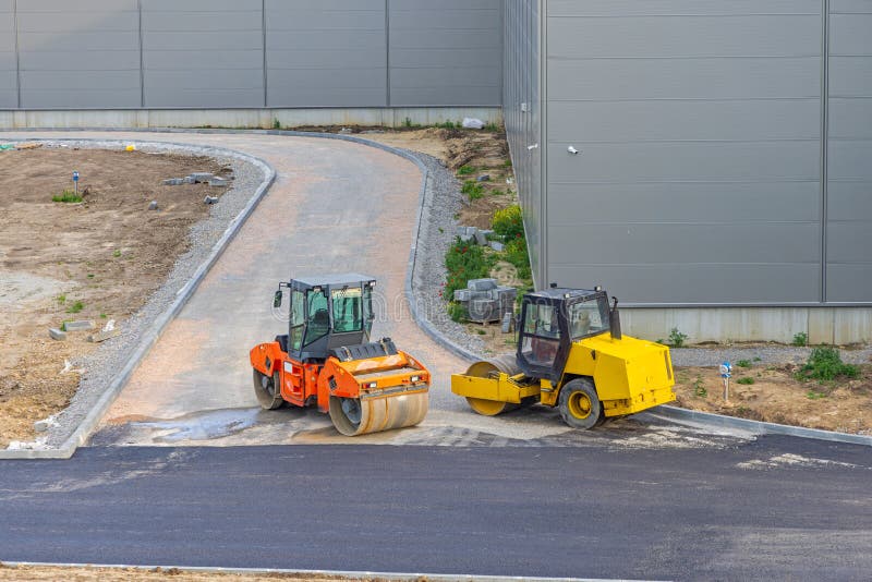 Two Rollers Construction Site Stock Photo - Image of building, company ...