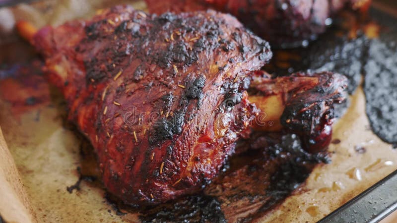 Two Roasted Mutton Lamb Leg Covered with Baking Paper on Baking Tray ...