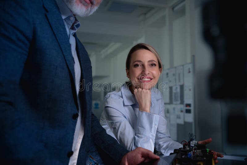 Two Robotics Engineers Working on New Project, Standing in Laboratory ...
