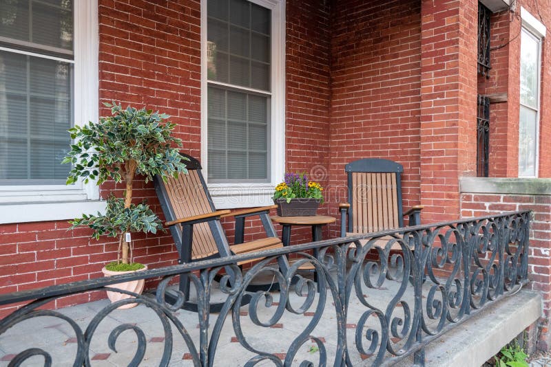 Two Rocking Chairs on a Porch with an Iron Railing Stock Image - Image ...