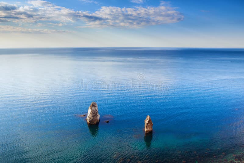Two rocks facing the sea stock photo. Image of sunrise - 71488978
