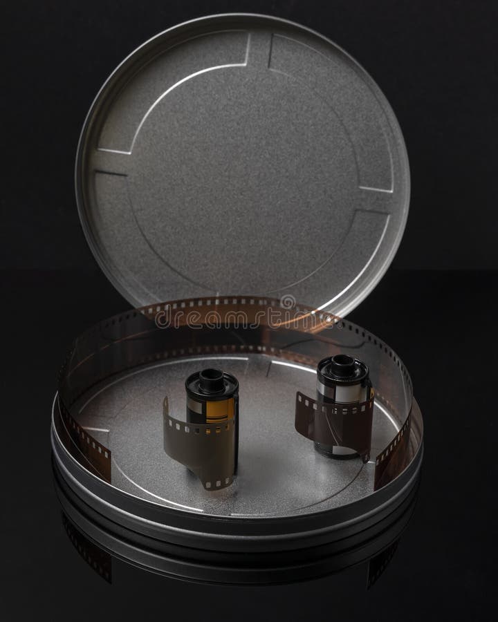 Two Old Rolls of Analog Photographic Film in a Circular Tin Container ...