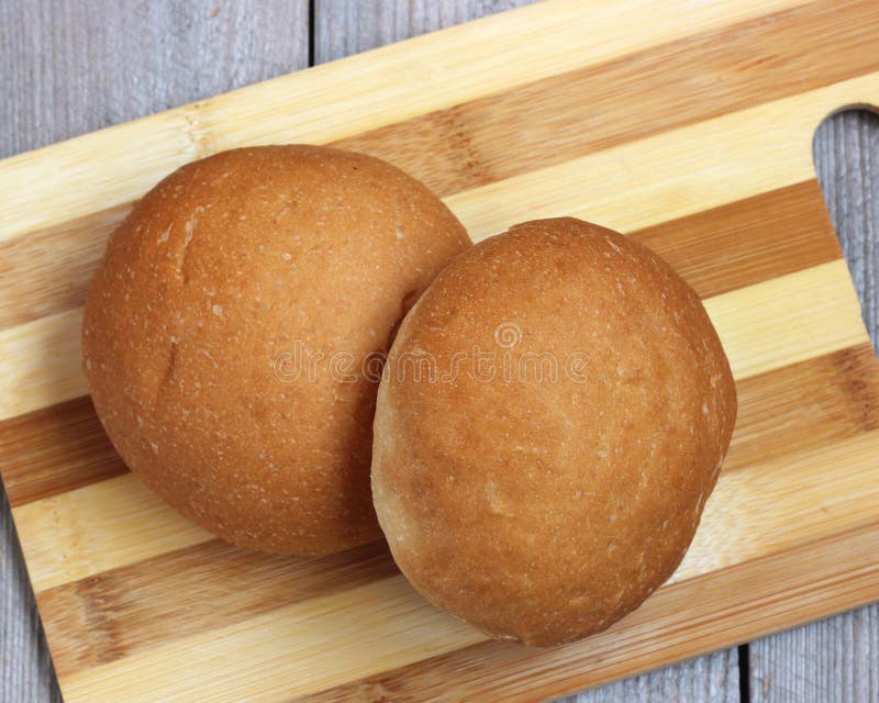 Two Rolls on a Cutting Board. Wheat Bread. Stock Photo - Image of white ...