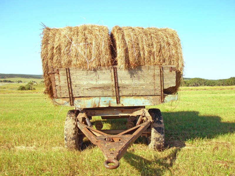 Two rolls of hay on a cart stock photo. Image of yield - 26351204