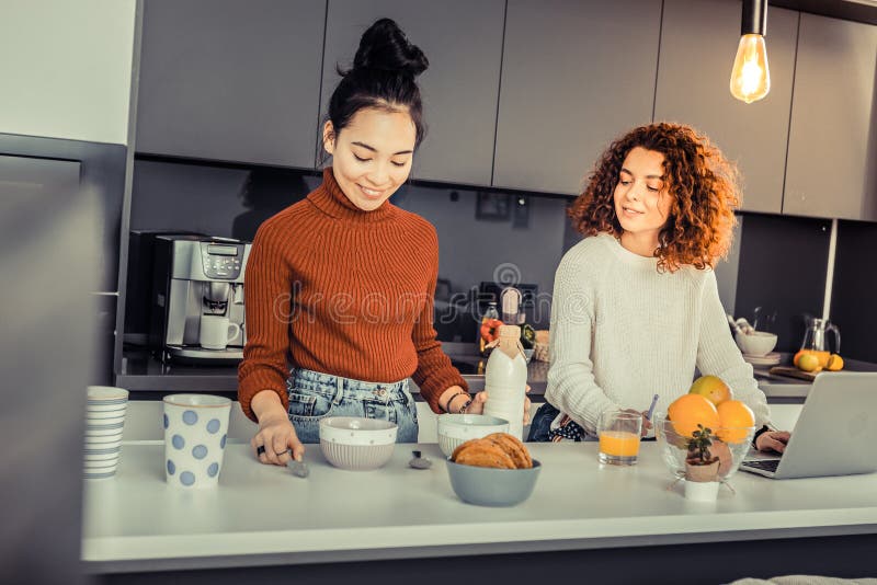 Two Roommates Cooking Their Breakfast Together before Work Stock Photo ...