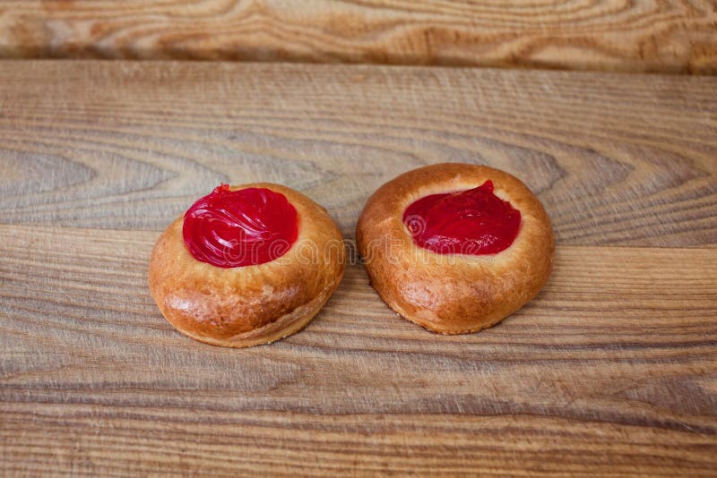 Two Round Buns with Red Cream on a Table Stock Image - Image of dinner ...